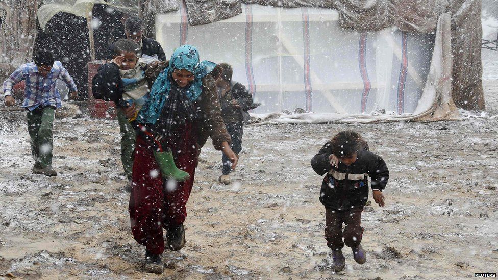 Winter under canvas: Storm hits Syrian refugees - BBC News