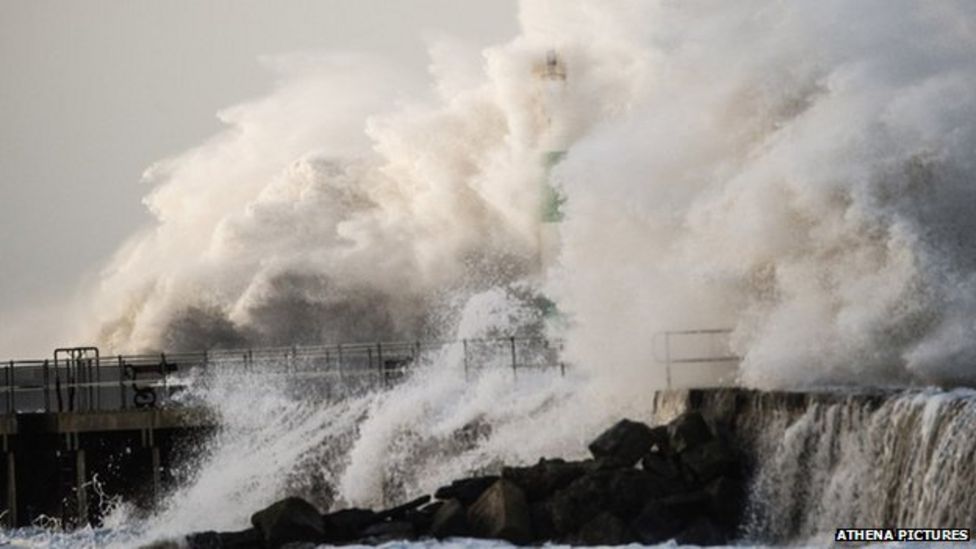 Storm surge brings flooding chaos moving up Wales' coast - BBC News