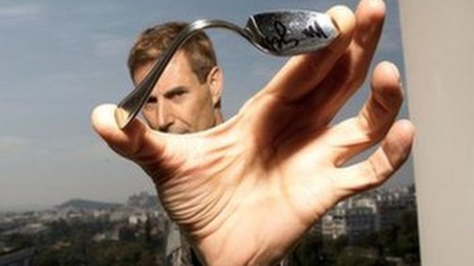 Uri Geller spoon gorilla statue unveiled - BBC News
