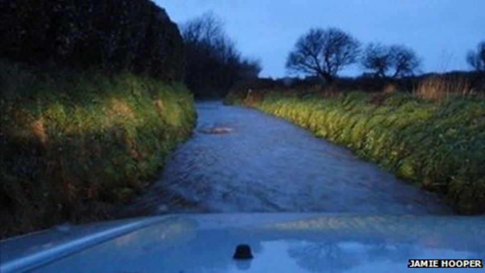 Jersey 'escaped worst' as flood warning downgraded - BBC News