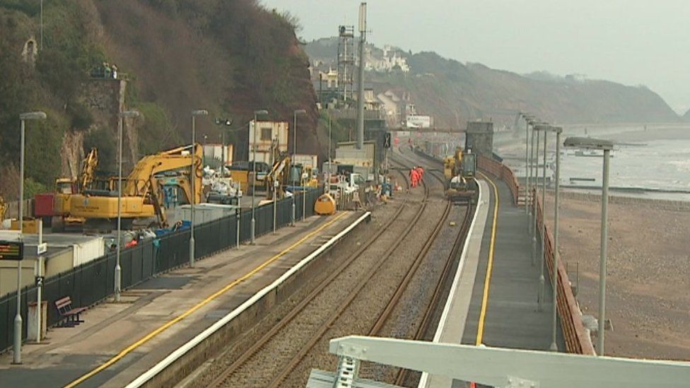 In pictures: Dawlish storm-hit railway line reopens - BBC News