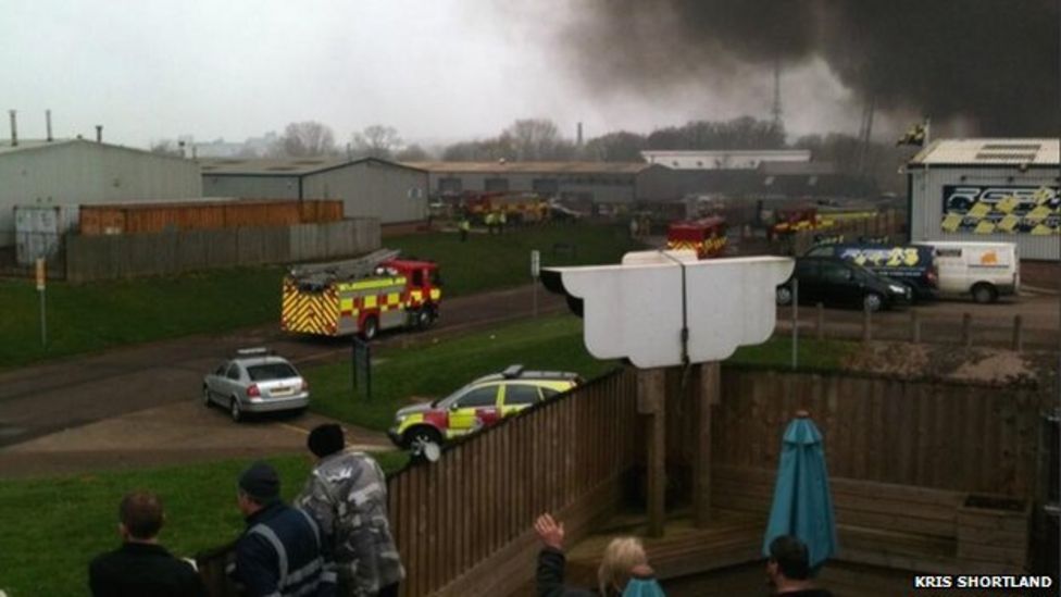 Wellingborough industrial estate fire continues to burn - BBC News