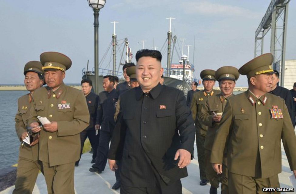 Why is Kim Jong-un always surrounded by people taking notes? - BBC News