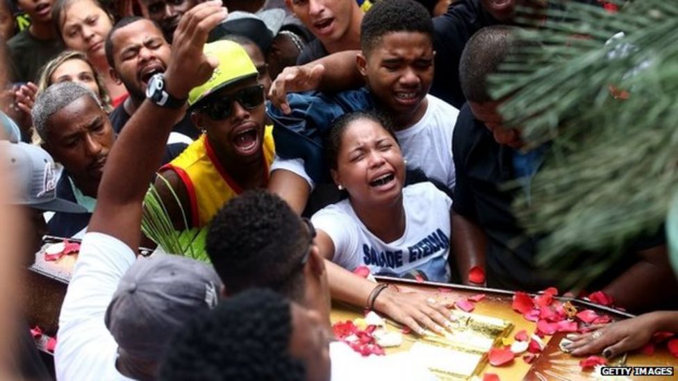 Rio police in fresh clashes with residents after burial of dancer - BBC ...