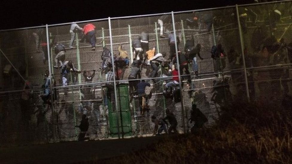 Migration surge hits EU as thousands flock to Italy - BBC News