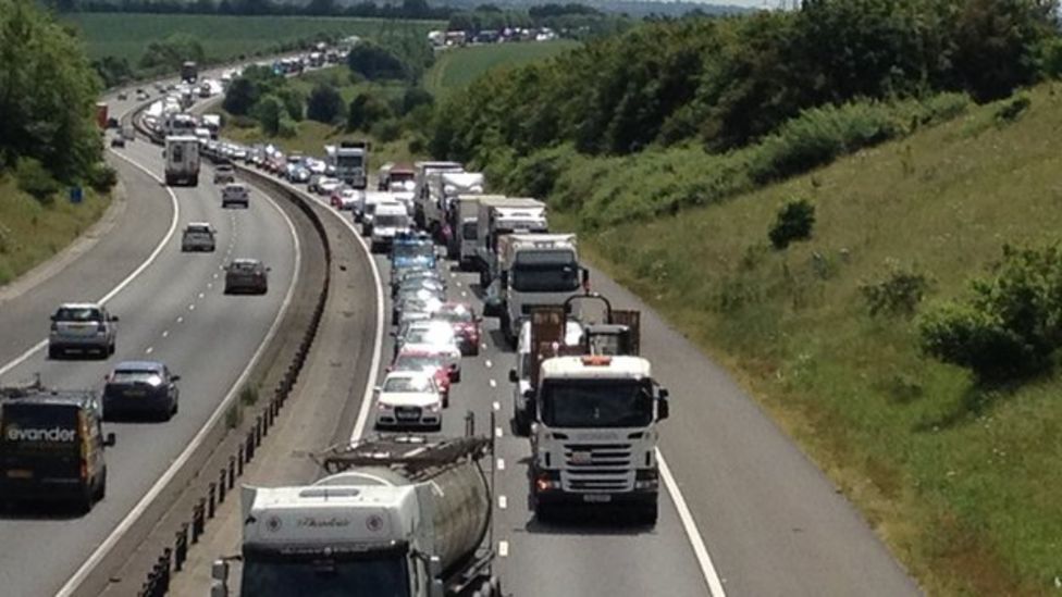 Double decker bus on M11 gutted by fire in Essex - BBC News