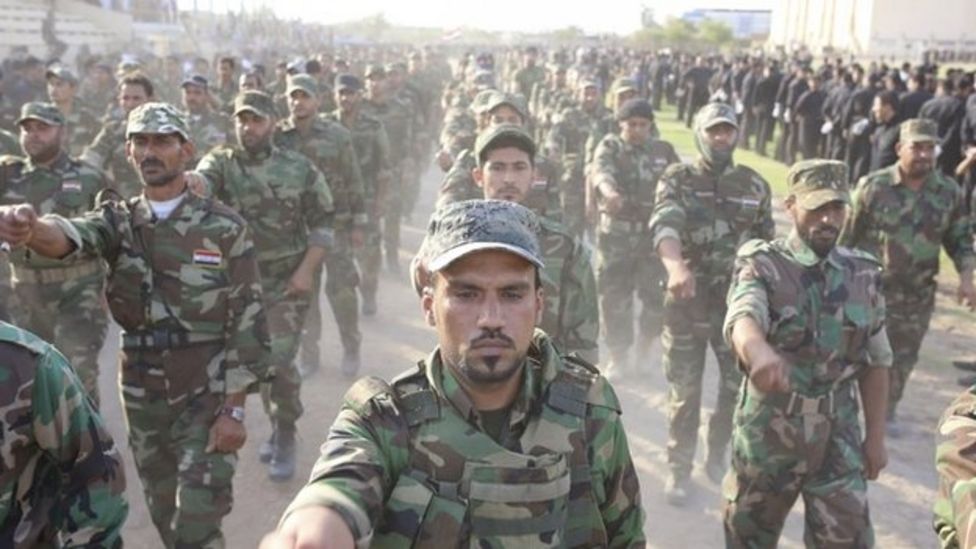 Iraq crisis: Shia militia show of force raises tensions - BBC News