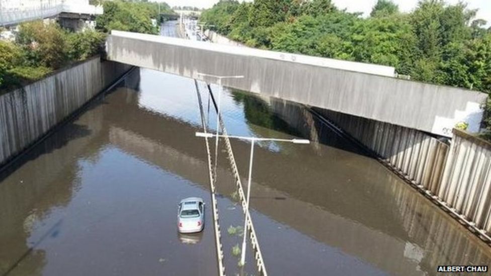 Women rescued from car in north-west London flash floods - BBC News