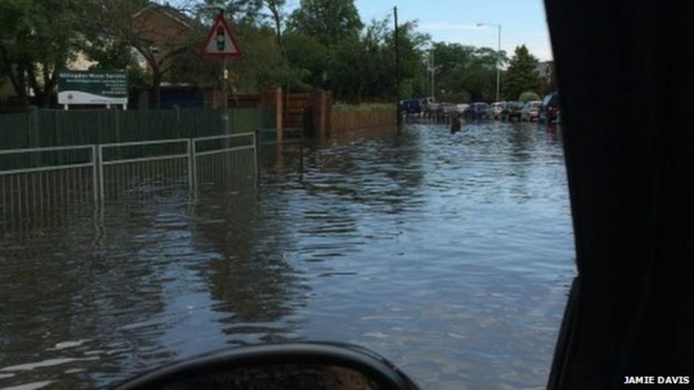 Torrential rain and flash flooding cause travel chaos - BBC News