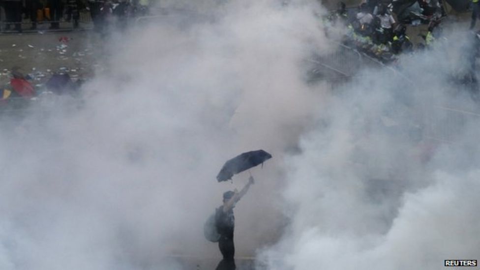 Hong Kong: Tear gas and clashes at democracy protest - BBC News