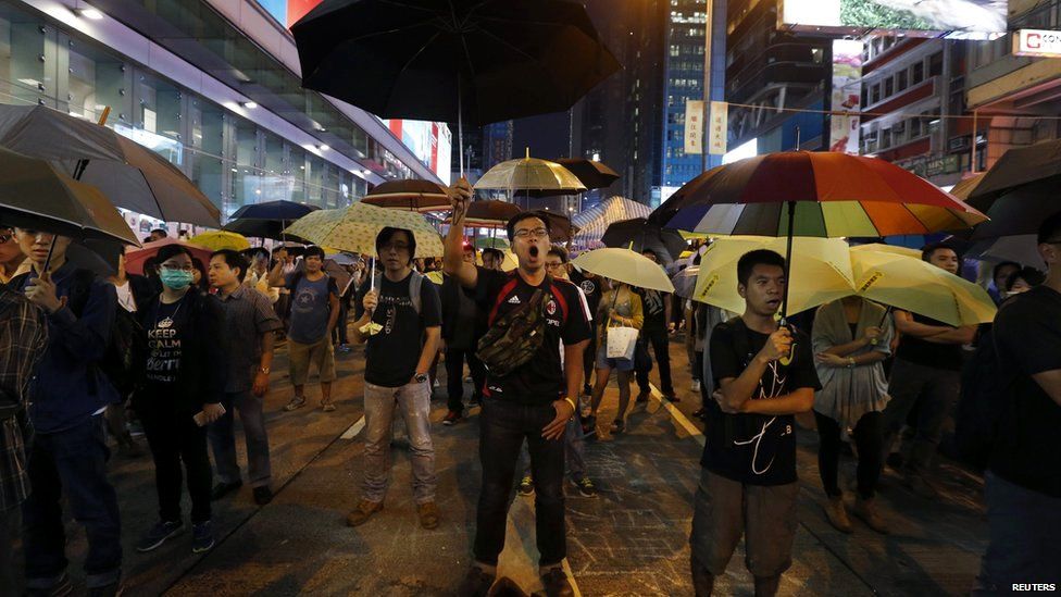 Thousands mark one month of Hong Kong protests - BBC News