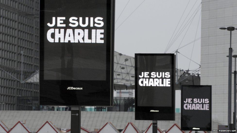 In pictures: Charlie Hebdo mourning and manhunt - BBC News