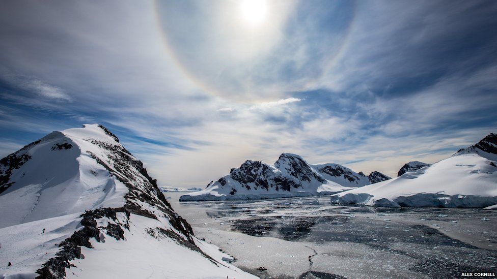 Upside-down iceberg in Antarctica looks like blue glass - BBC Newsround