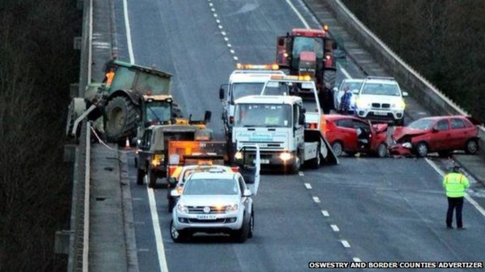 Tractor hanging off bridge closes A5 Chirk bypass, Wrexham - BBC News