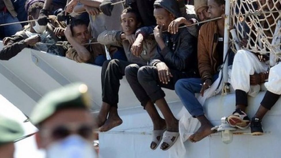 Migrants flood trains in desperate bid to leave Italy - BBC News