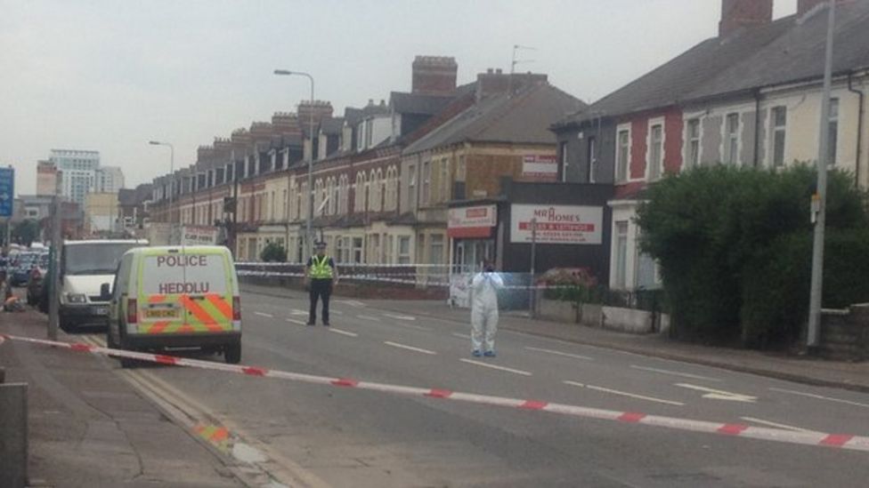 Police hunt man, 47, after woman stabbed in Cardiff - BBC News