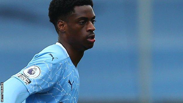 Nathanael Ogbeta: Shrewsbury Town sign Manchester City left-back - BBC ...
