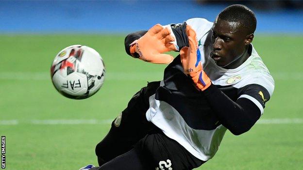 Senegal goalkeeper Alfred Gomis leaves Italy for Djion - BBC Sport