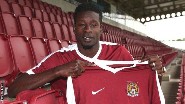 Leon Barnett: Northampton Town sign defender from Bury - BBC Sport