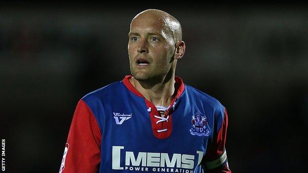 Adam Barrett signs two-year Gillingham contract extension - BBC Sport