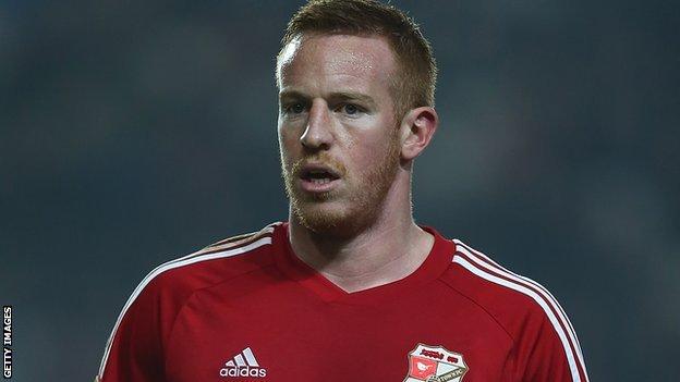 Adam Rooney: Swindon Town will 'review' striker's contract - BBC Sport